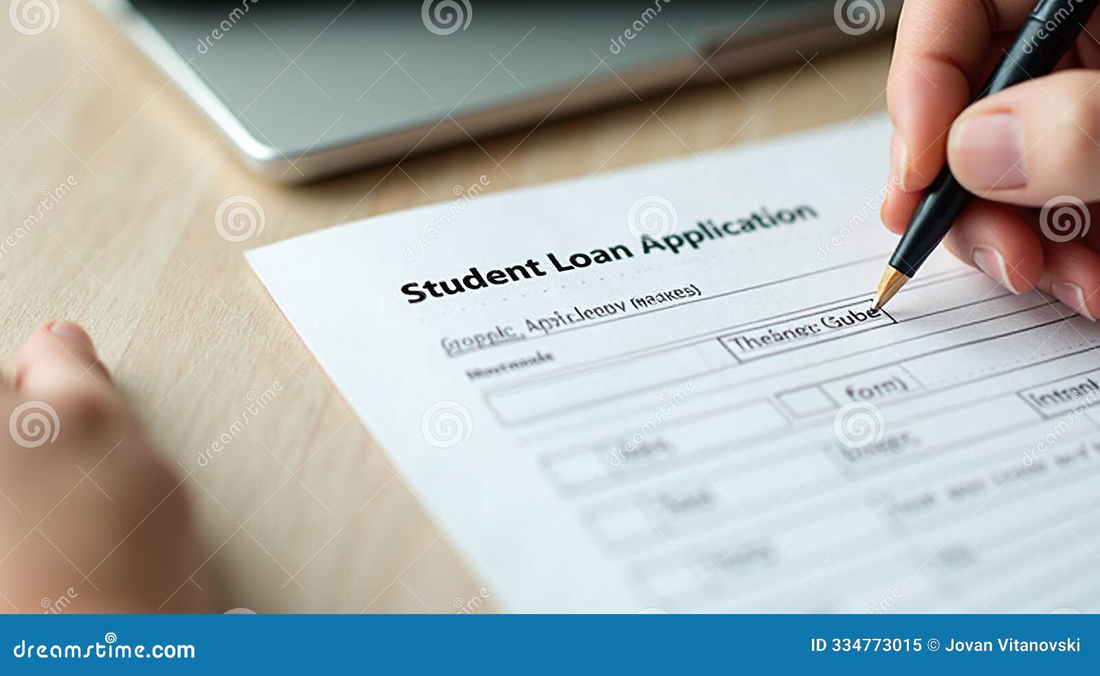Filling Out a Student Loan Application Form with a Pen Stock ...