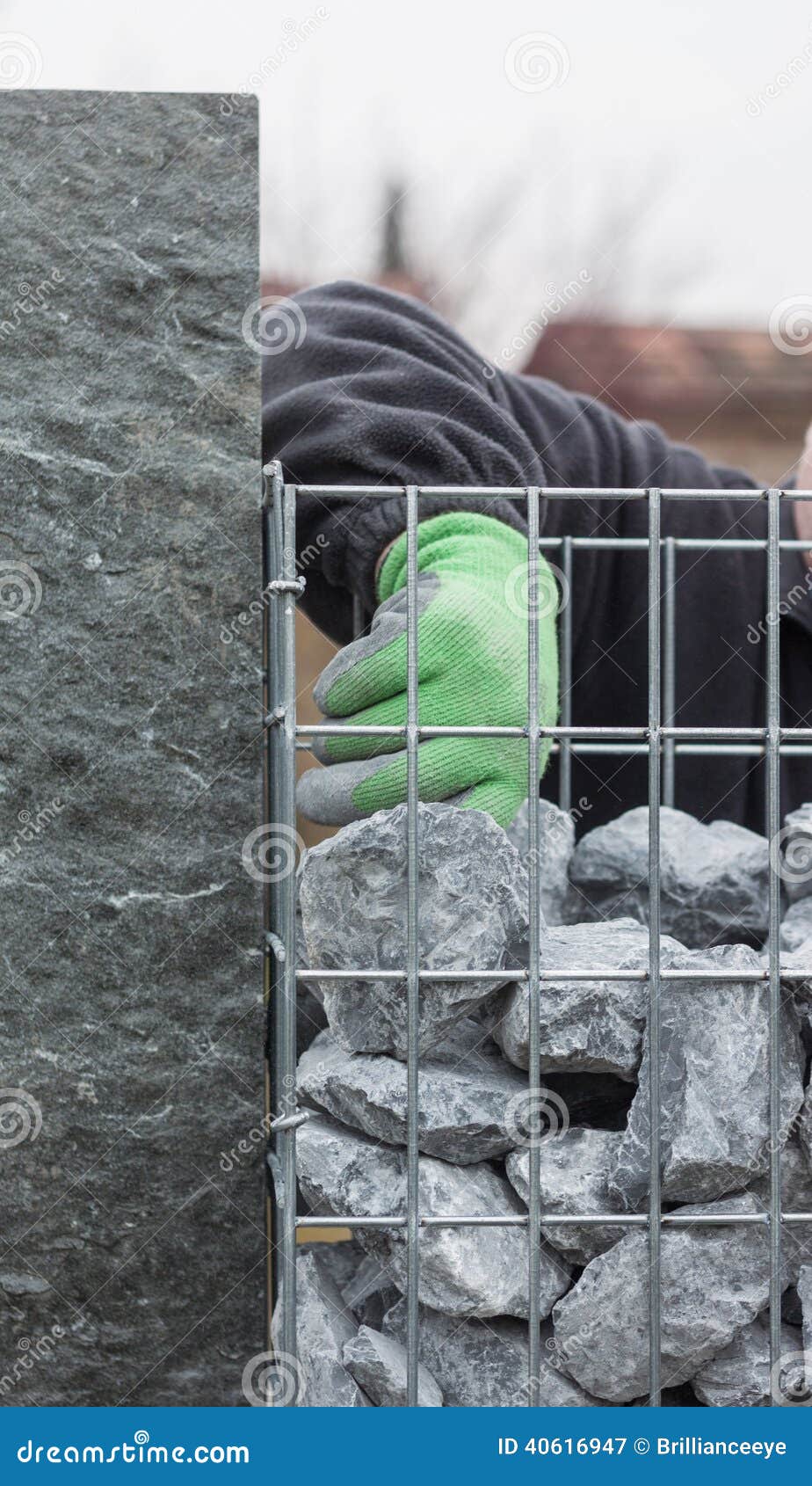 Filling the Stone Wall with Gravel Stock Image - Image of coast, steel ...