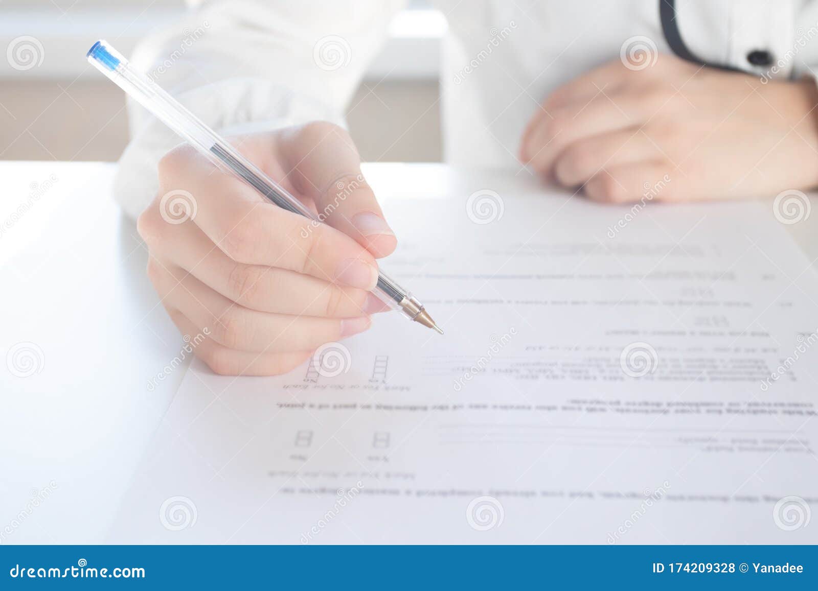 Filling the Test. Hands Hold a Pen Over Paper Stock Photo - Image of ...