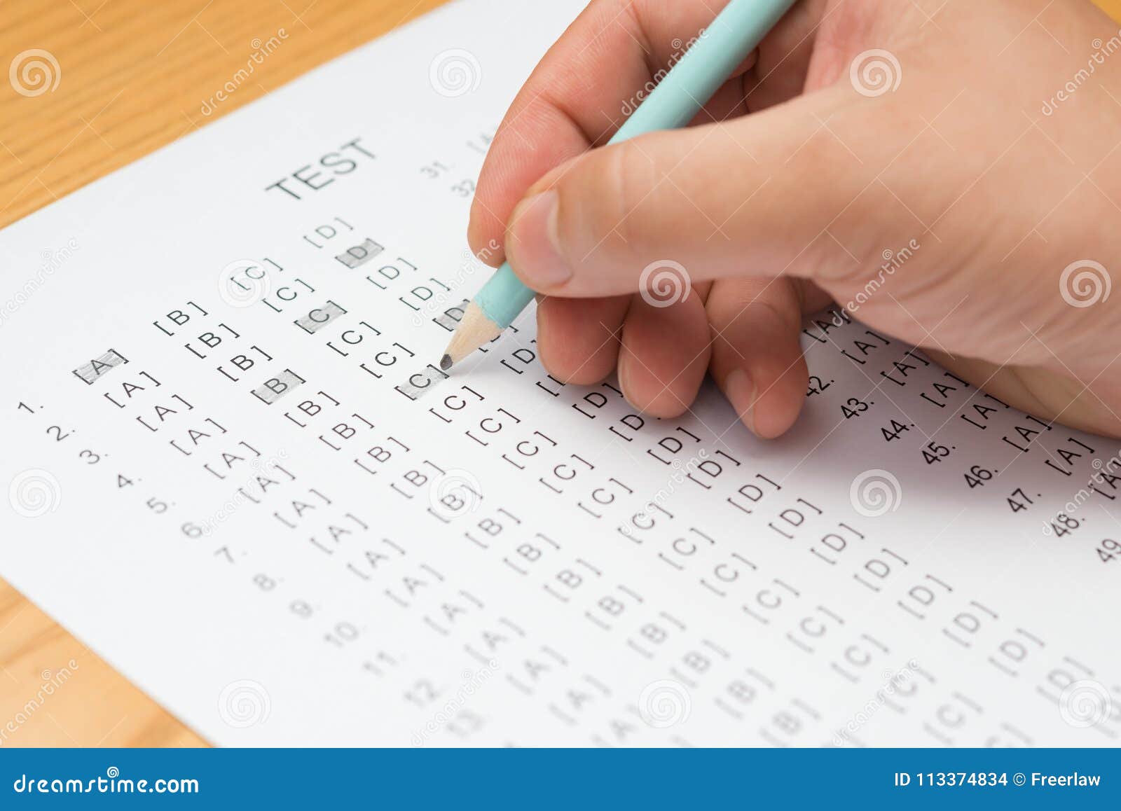 Filling test score sheet stock photo. Image of hand - 113374834