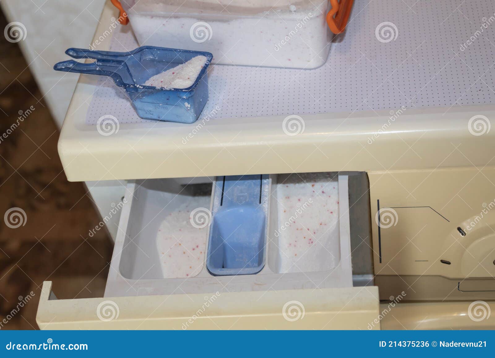 Filling the Washing Machine with Washing Powder. Stock Photo - Image of ...