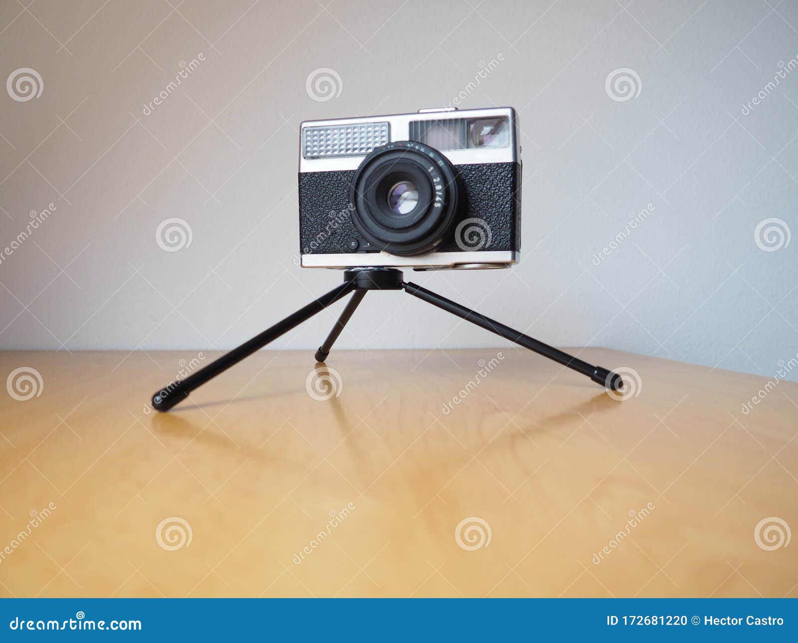 Vintage camera on a tripod stock photo. Image of small - 172681220