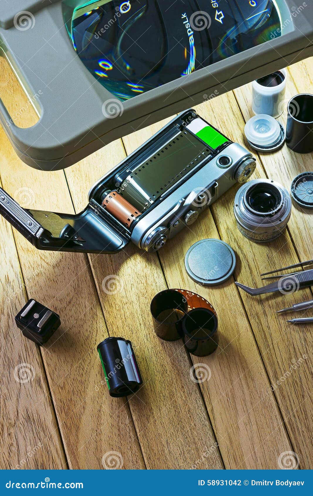 Film Camera on a Table Under a Magnifying Glass Stock Photo - Image of ...