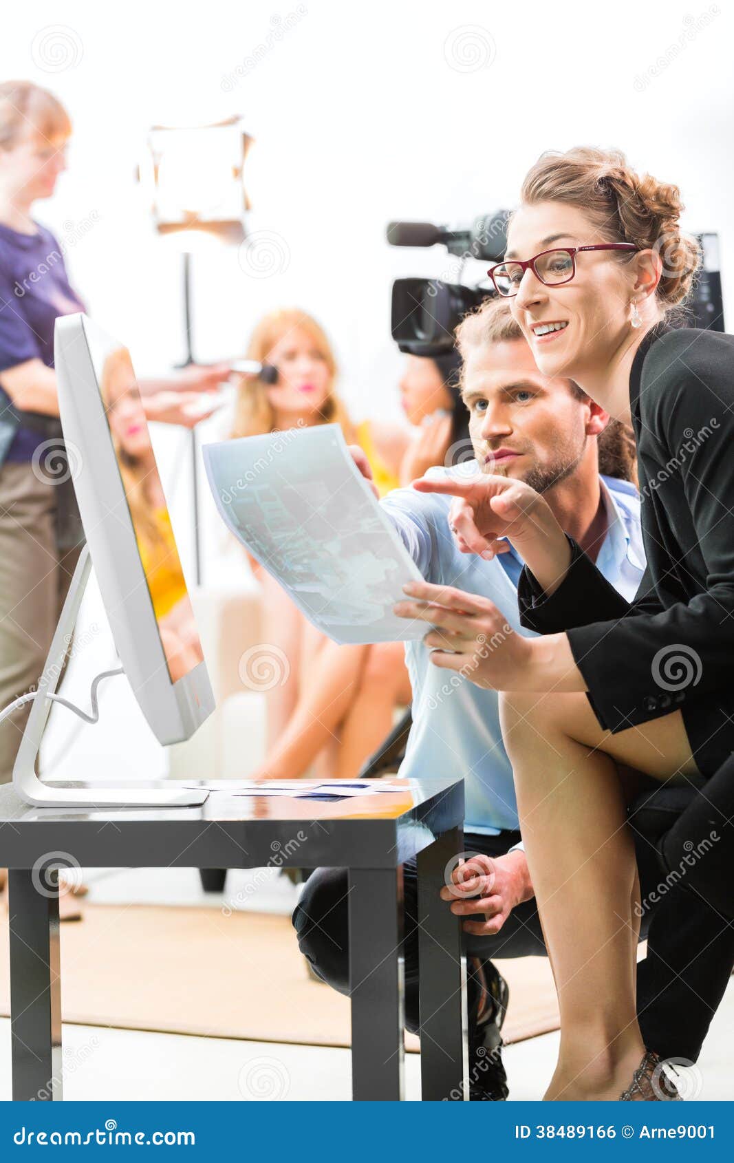 Film Team Discussing Direction for Video Production Stock Photo - Image ...