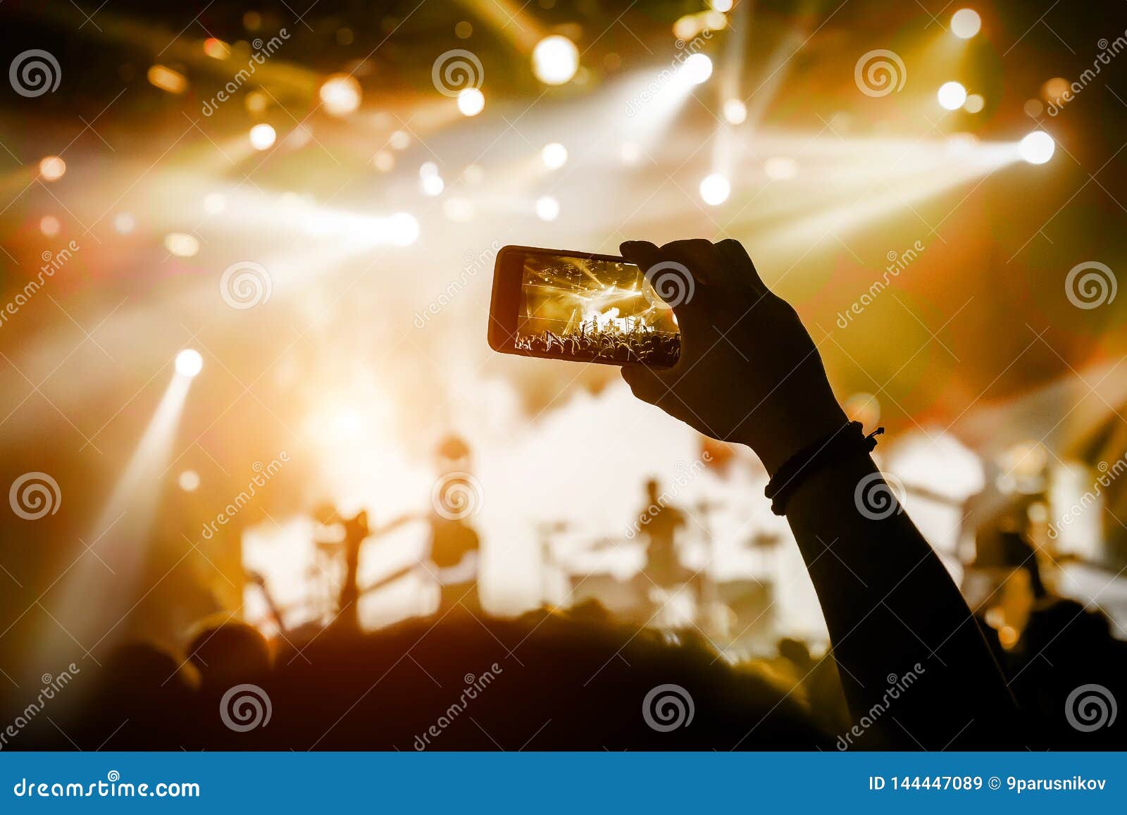 Filming a Concert on Mobile Phone Camera, Yellow Light Stock Image ...