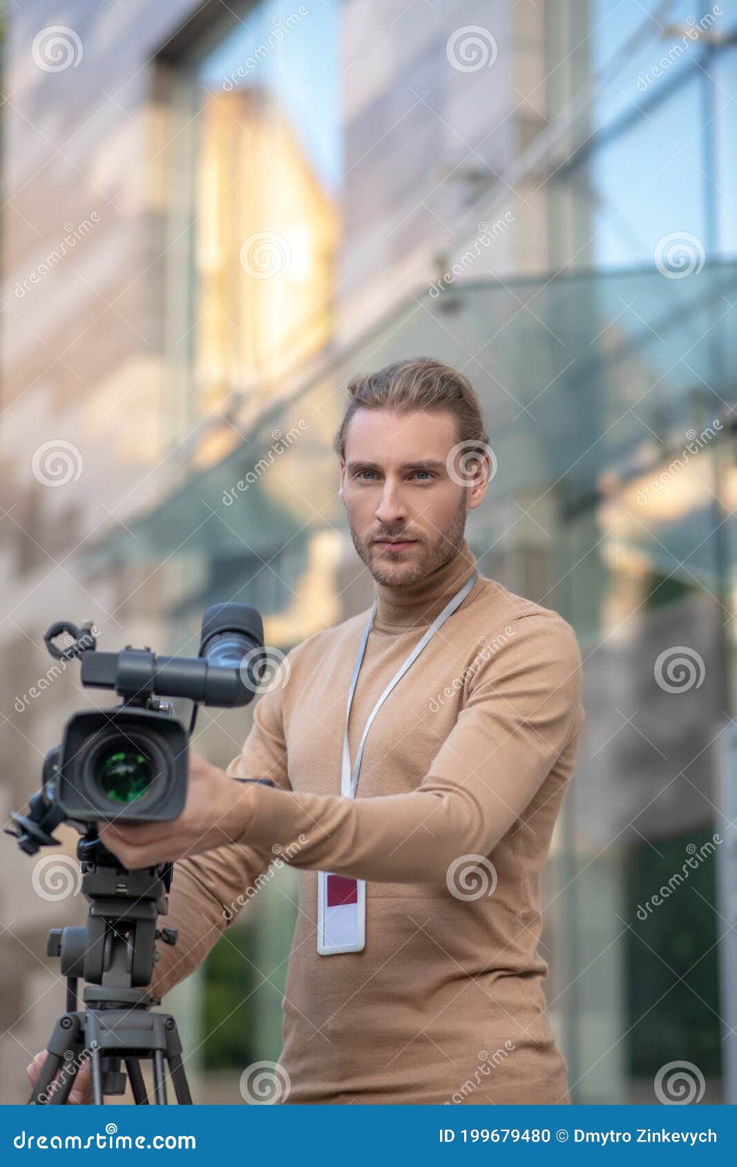 Involved Operator Standing Behind Camera, Busy with Filming Stock Photo ...