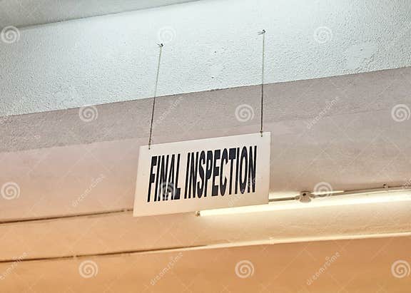 Final Inspection Hanging Sign from Low Angle Stock Photo - Image of ...
