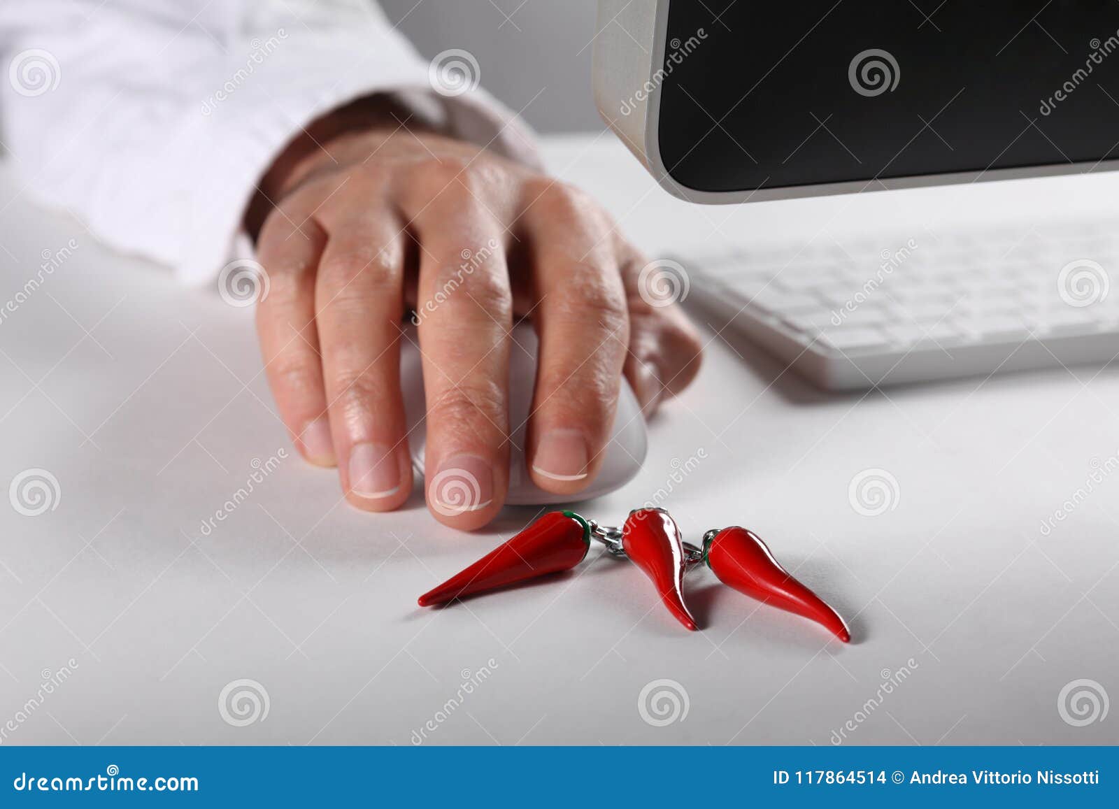 Finance Concept: Man`s Hand Using a Computer with Good Luck Icon on the ...