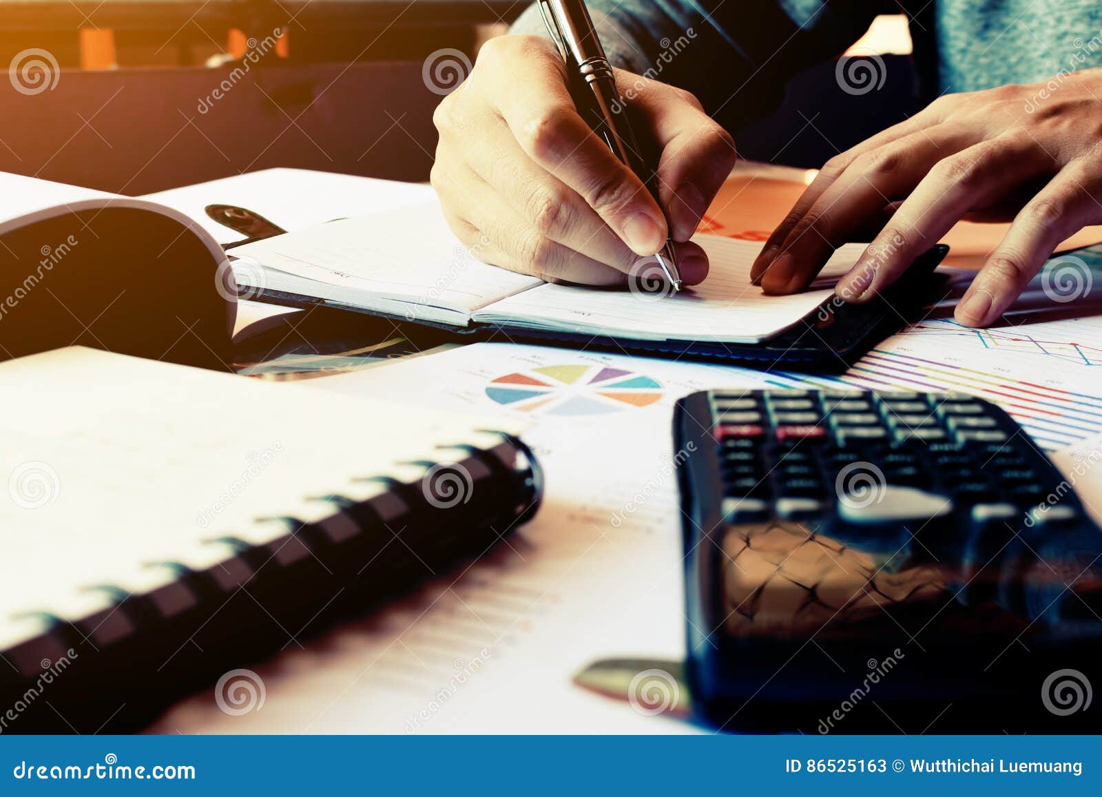 Finance Concept. Man Writing and Make Note about Cost and Expenses at ...