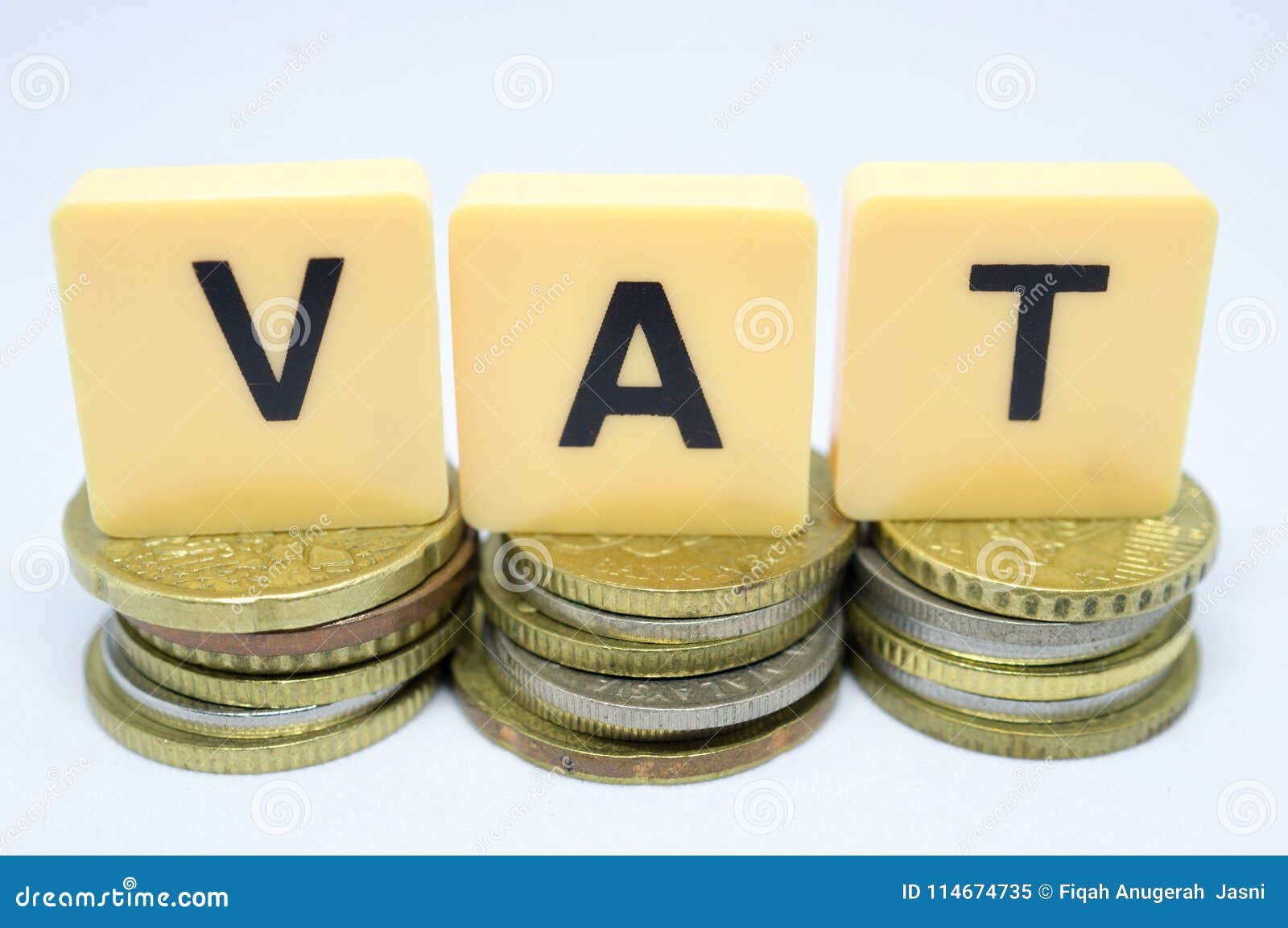 Finance Concept with Stack of Coins - VAT Value Added Tax Written on ...