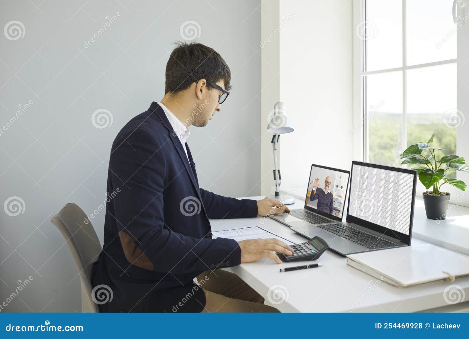 Financial Accountant Using Office Laptops, Working with Spreadsheets ...