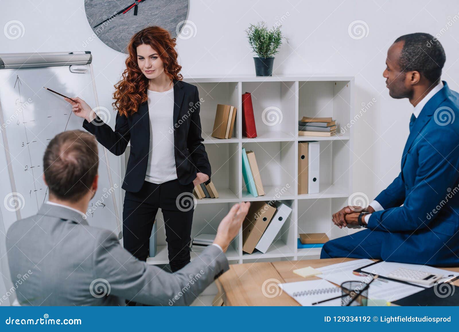 Financial Adviser Showing Presentation To Clients Stock Photo - Image ...