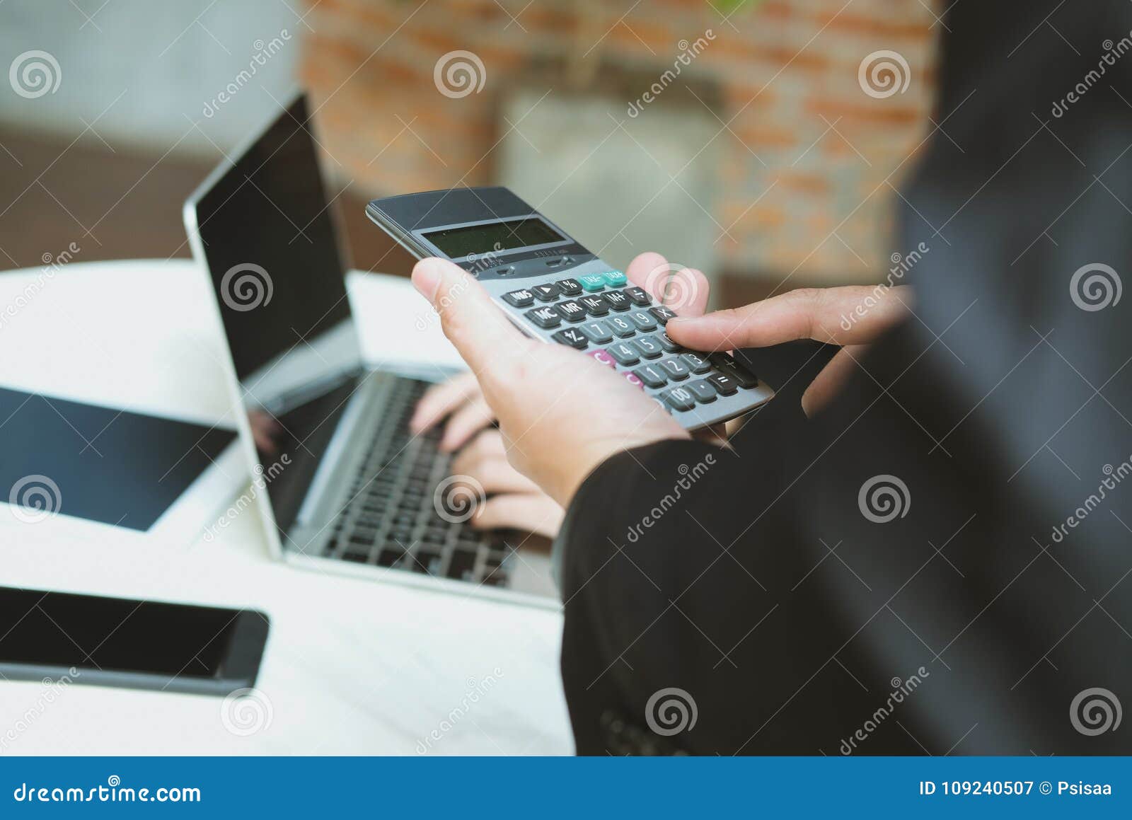 Financial Adviser Working with Calculator & Computer at Office. Stock ...