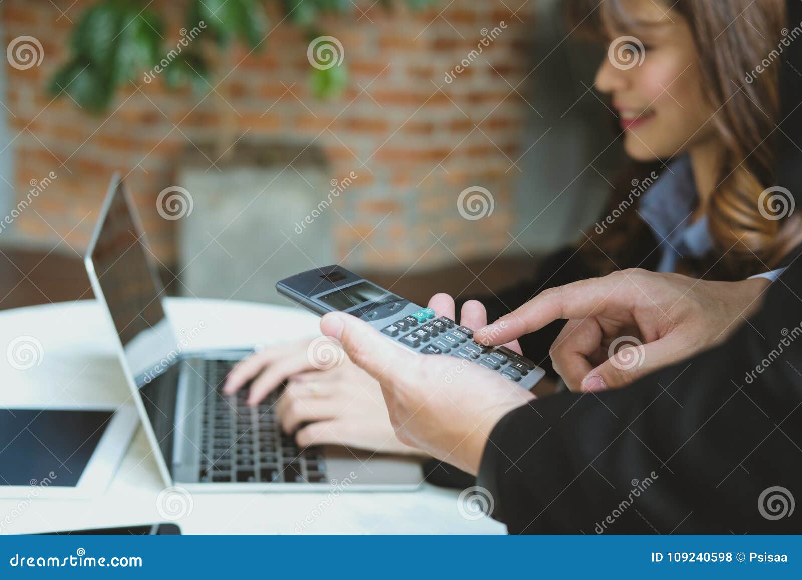 Financial Adviser Working with Calculator & Computer at Office. Stock ...