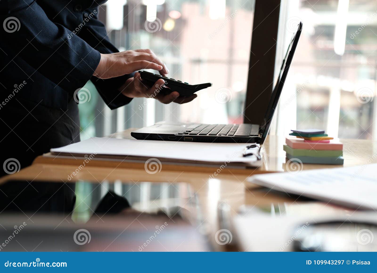 Financial Adviser Working with Calculator & Computer at Office. Stock ...