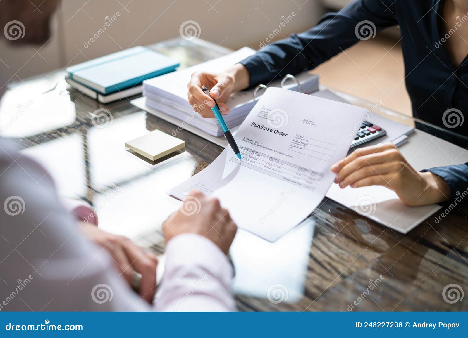 Financial Advisor Discussing Invoice with Her Client Stock Photo ...