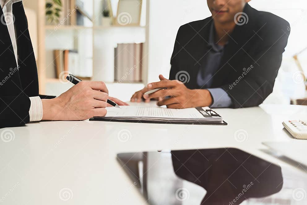 Financial Advisor Explaining Investment Options with a Client Stock ...