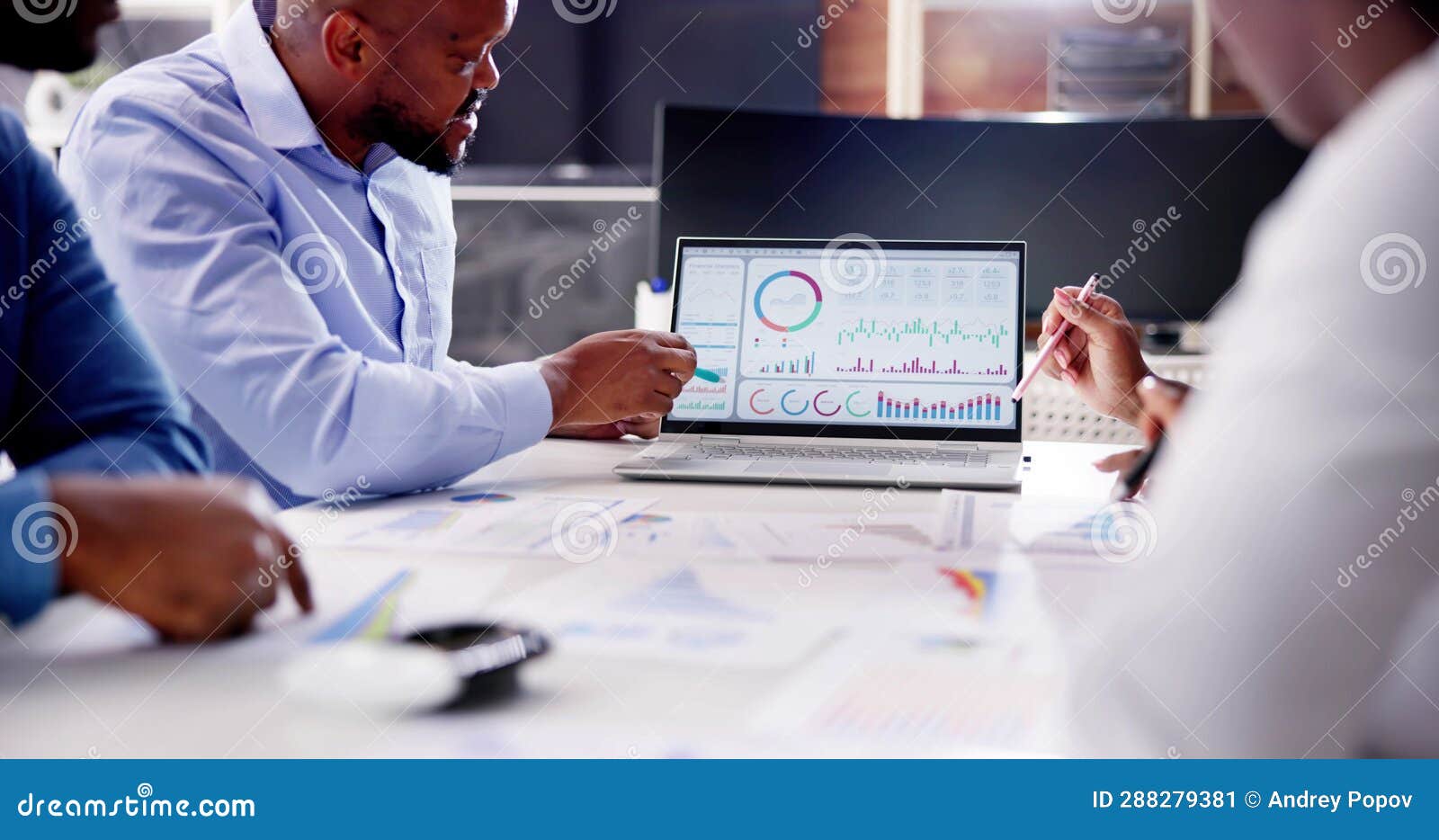 Financial Advisor Group Meeting Examining Analytics Stock Image - Image ...