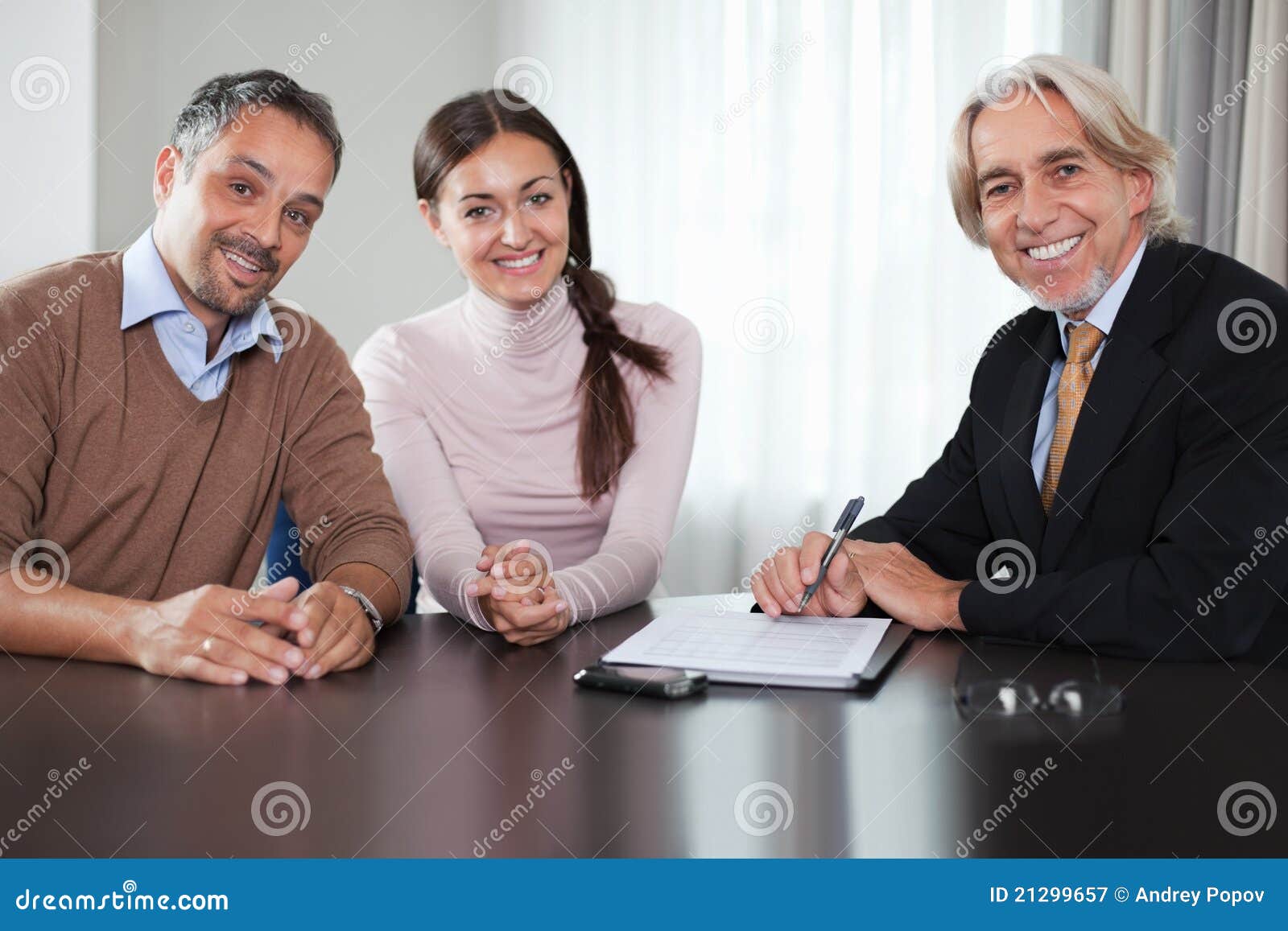 Financial Advisor in Meeting with a Young Couple Stock Image - Image of ...