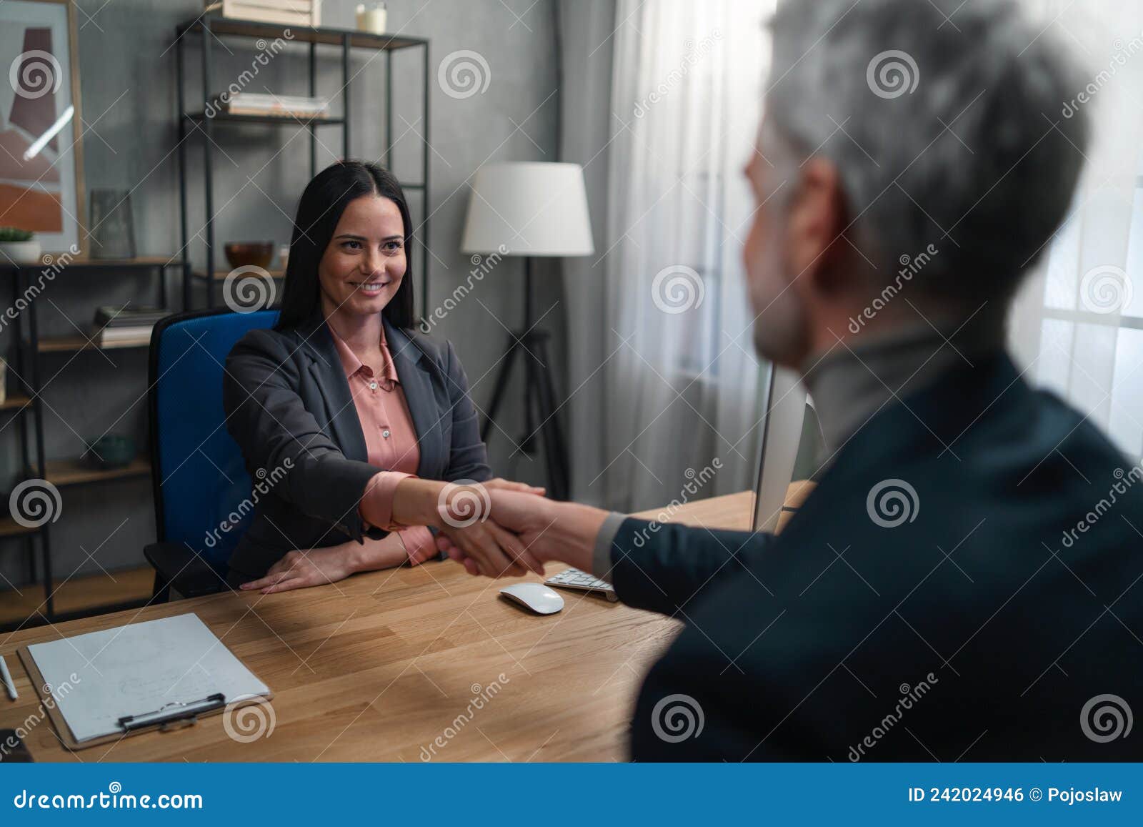 Financial Advisor Shaking Hand with Her Client Indoors in Office. Stock ...