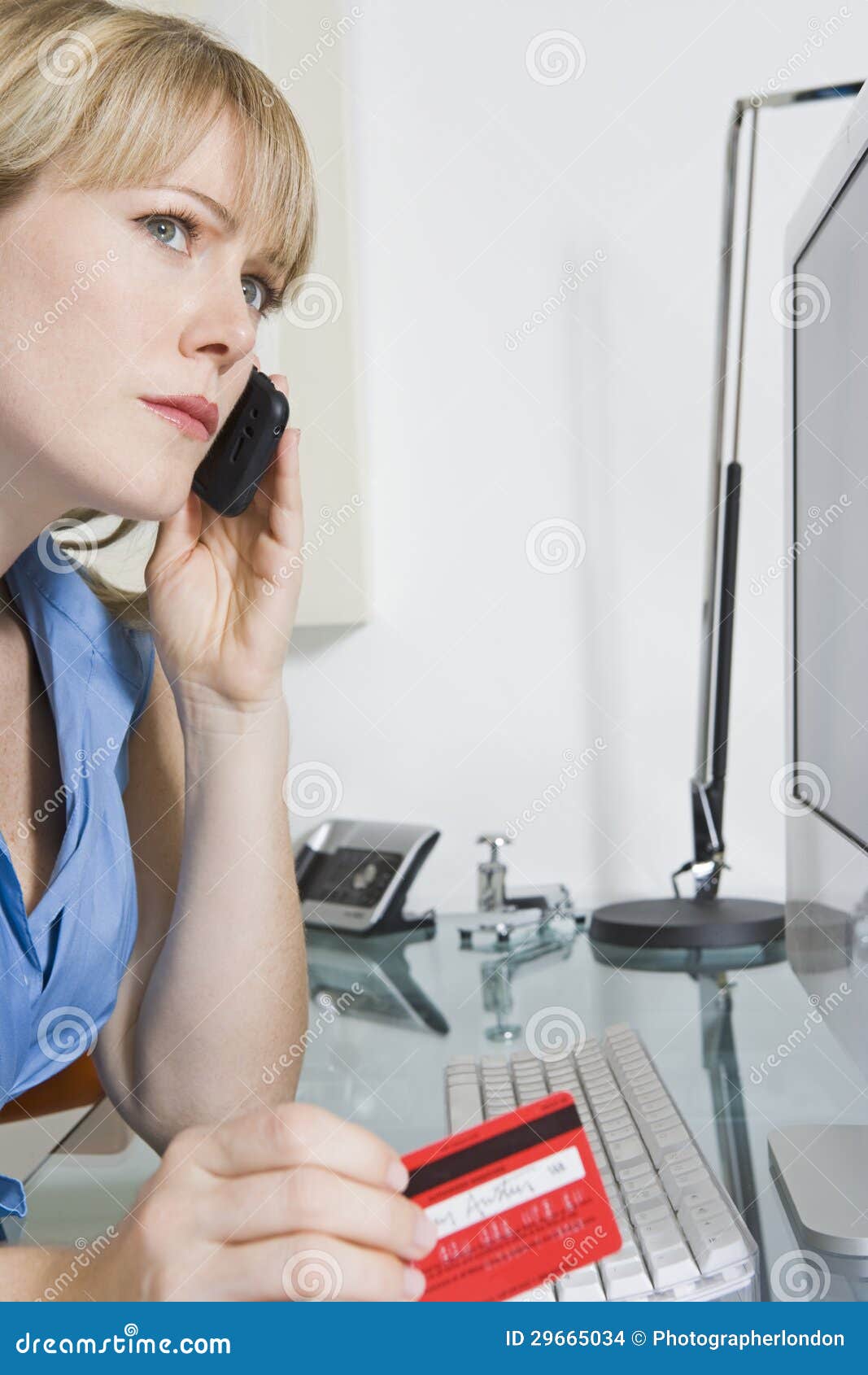 Financial Advisor Using Cell Phone while Holding Credit Card Stock ...