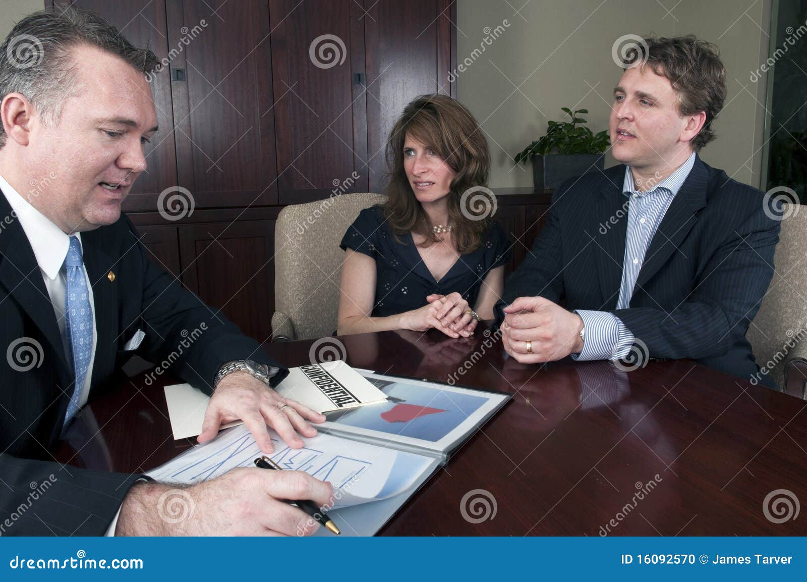 Financial Advisor Working with Concerned Clients Stock Photo - Image of ...