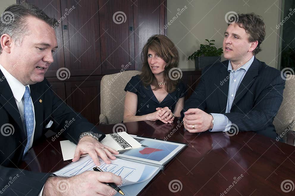 Financial Advisor Working with Concerned Clients Stock Photo - Image of ...