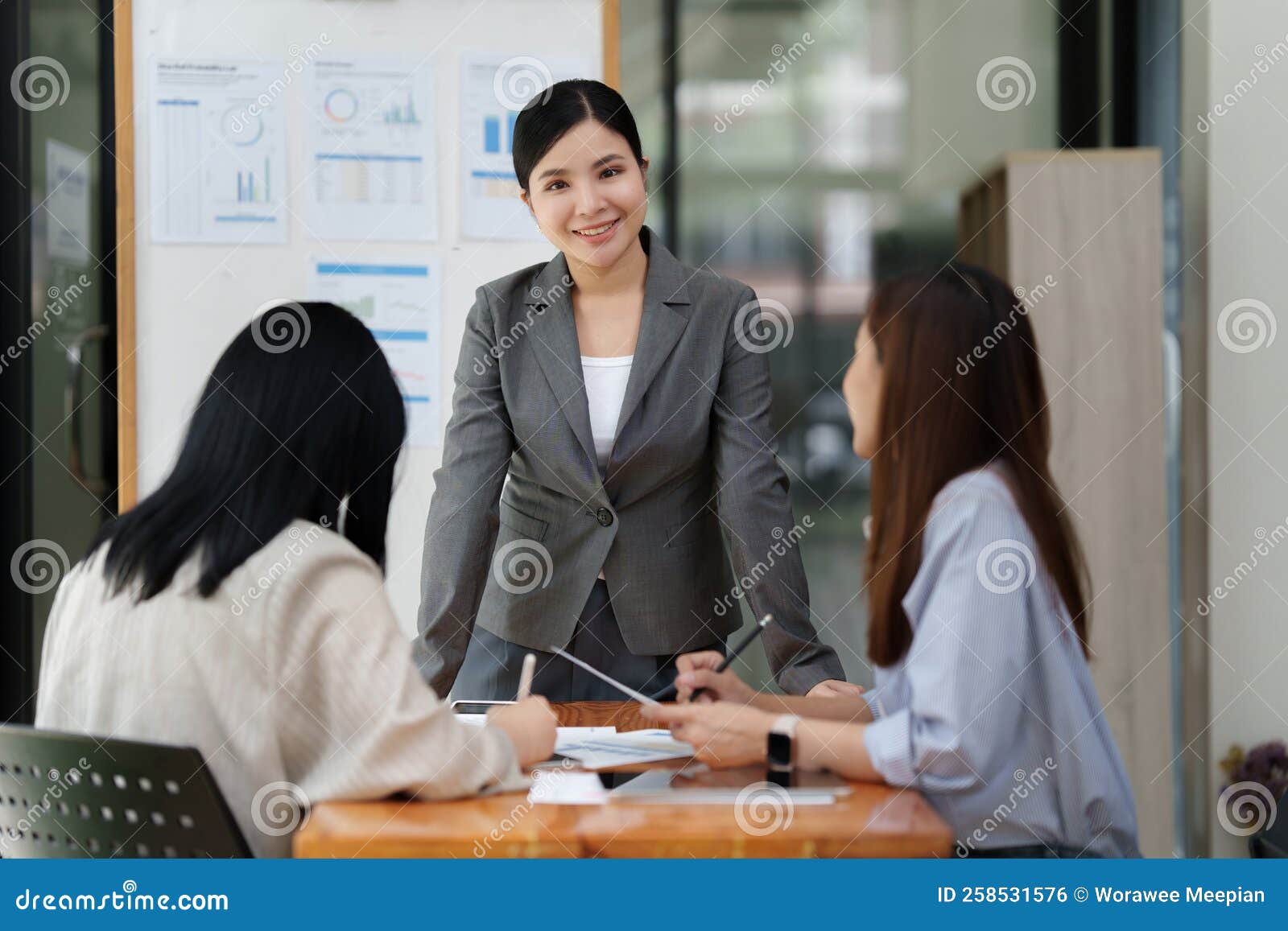 Financial Analyst Discussing with Investment Banker at Meeting Room ... Financial Analyst Discussing with Investment Banker at Meeting Room ...