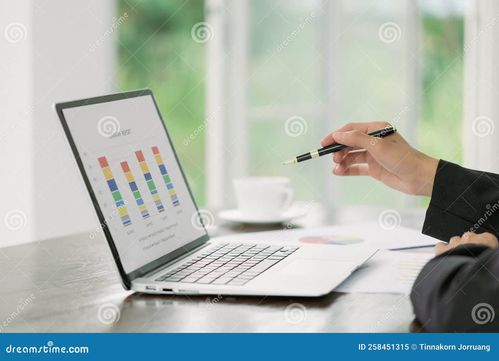 Financial Analyst with Document in His Hands Reading Information on ...