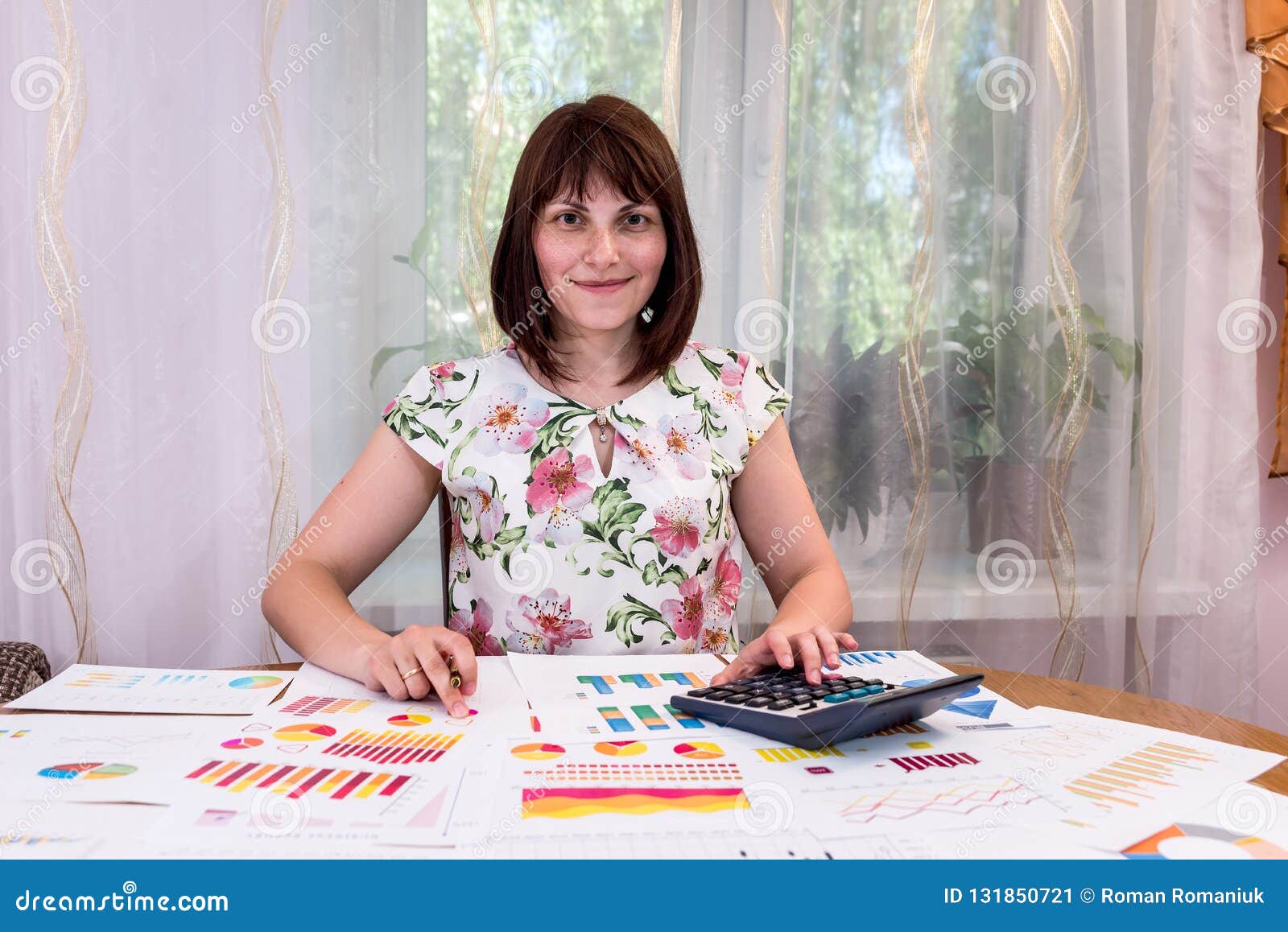 Financial Analyst Smiling and Doing Calculations in Office/ Stock Image ...