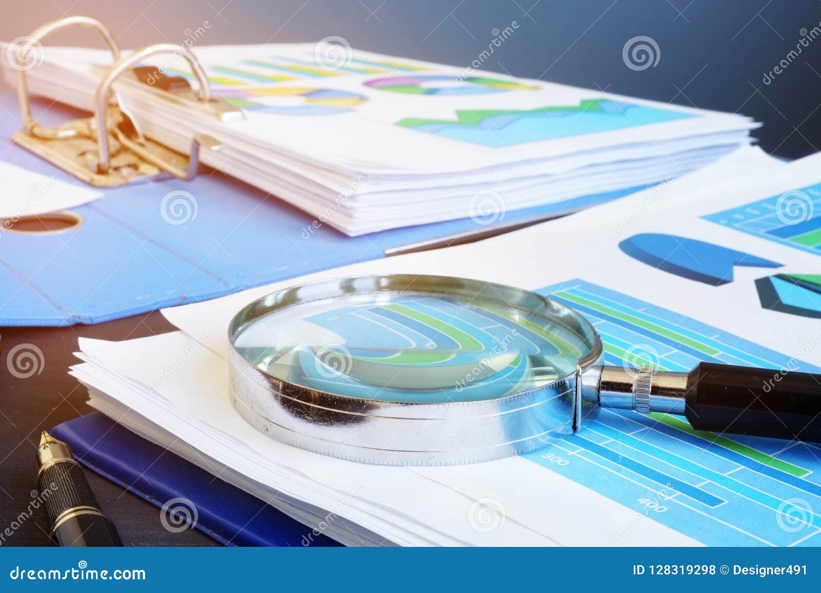 Financial Audit Report and Magnifying Glass on a Desk. Stock Photo ...