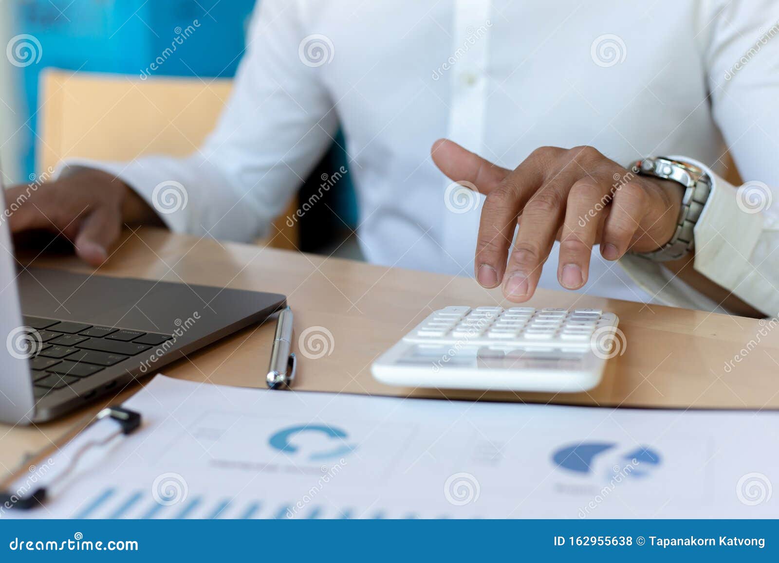 A Financial Businessman, a Young Man Analyzes Financial Data Using a ...