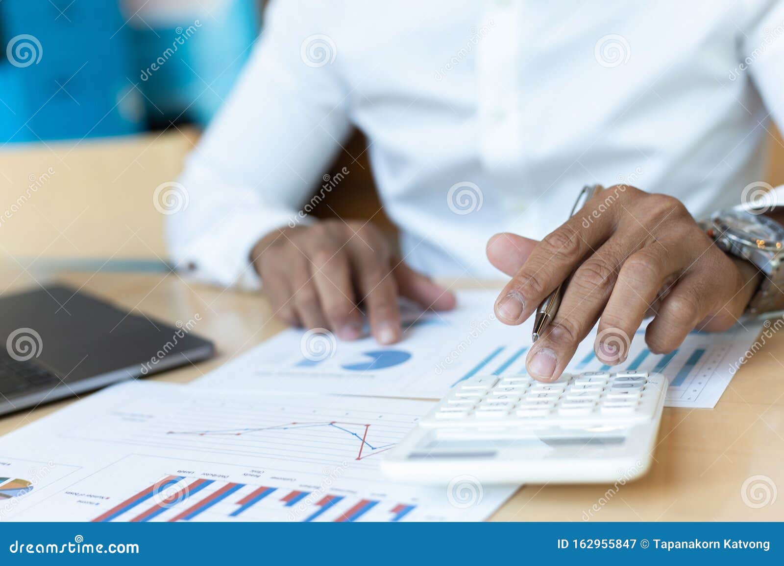 A Financial Businessman, a Young Man Analyzes Financial Data Using a ...