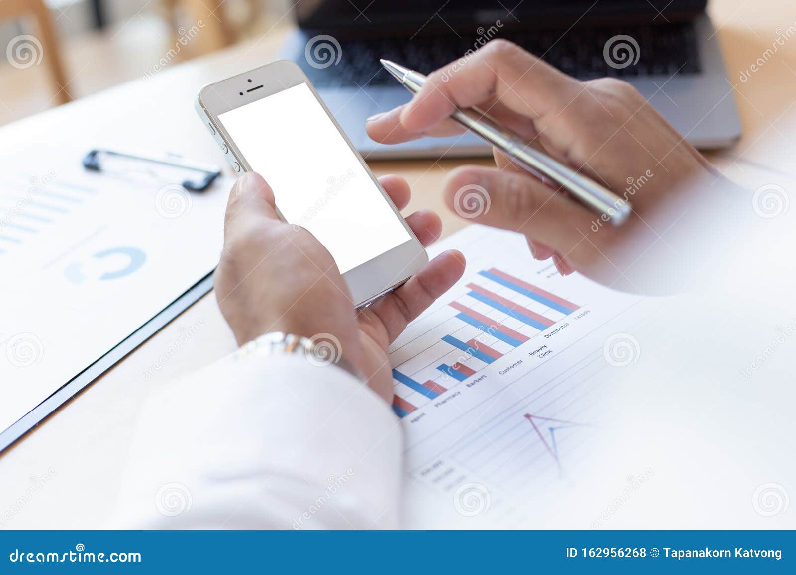 A Financial Businessman, a Young Man Analyzes Financial Data Using a ...
