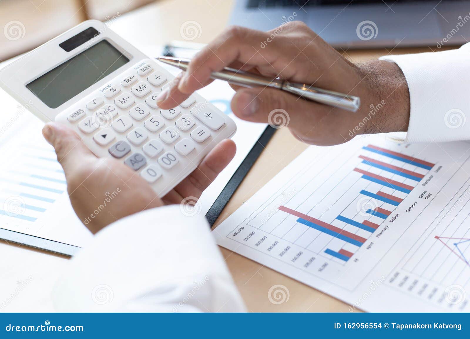 A Financial Businessman, a Young Man Analyzes Financial Data Using a ...