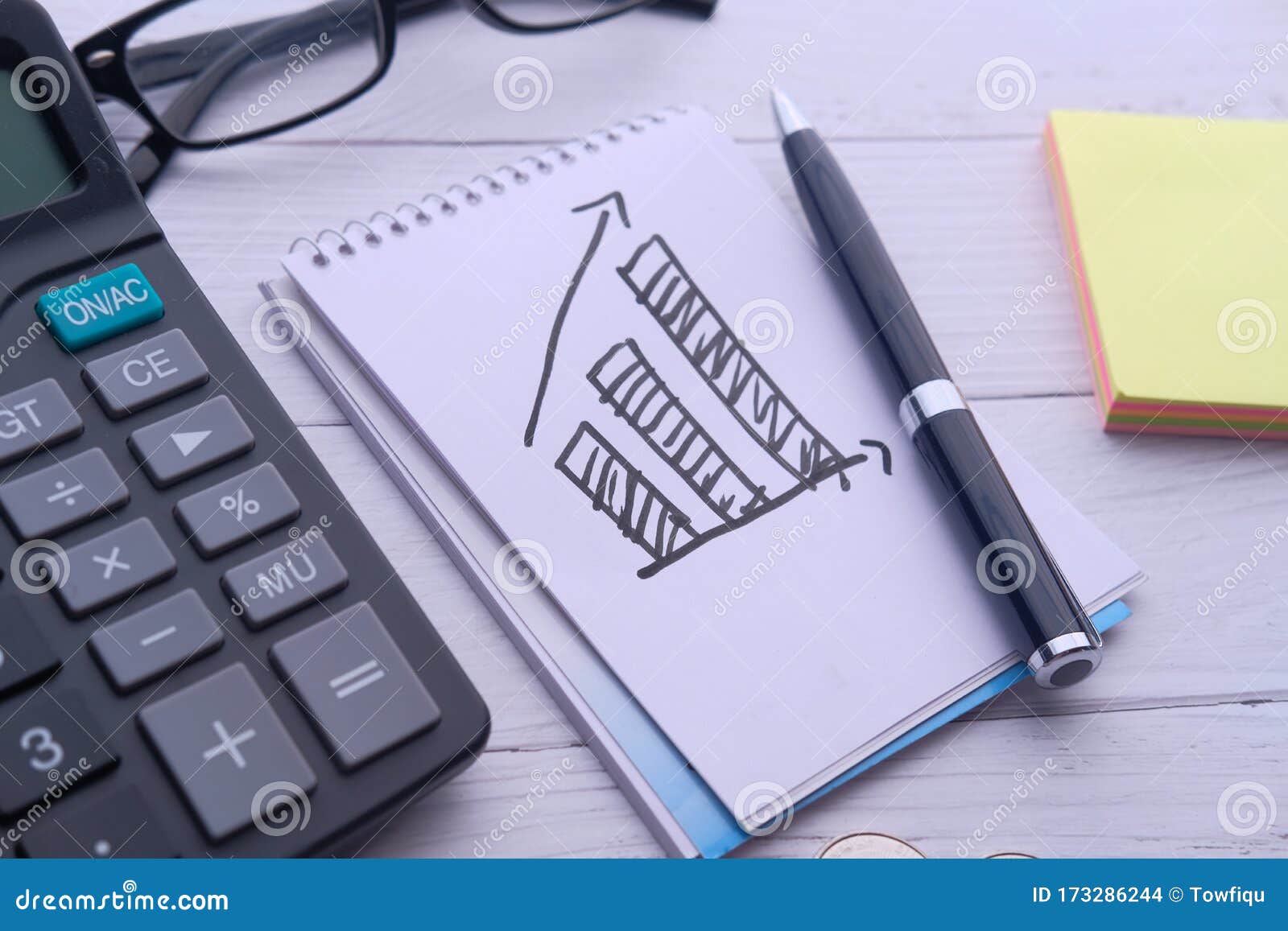 Financial Chart on Notepad and Calculator on Table , Close Up Stock ...