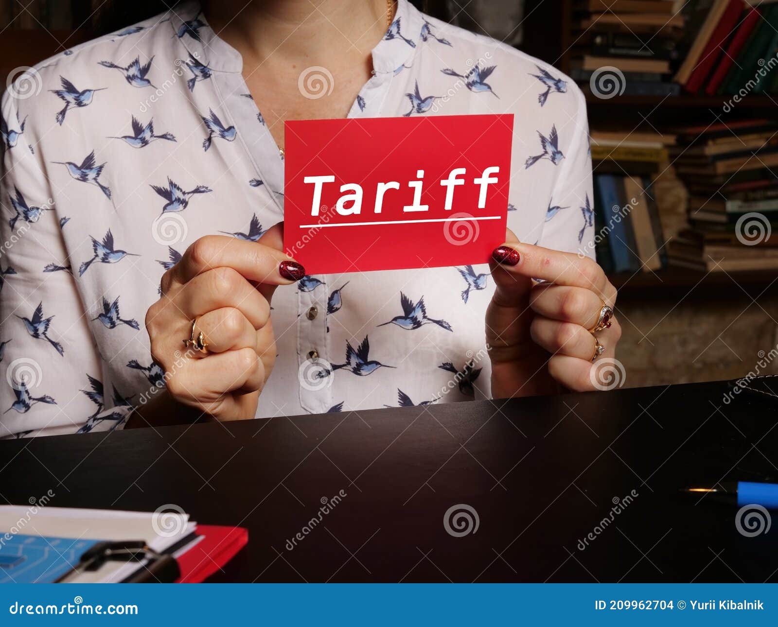 Financial Concept Meaning Tariff with Sign on Blank Card in Hand Stock ...
