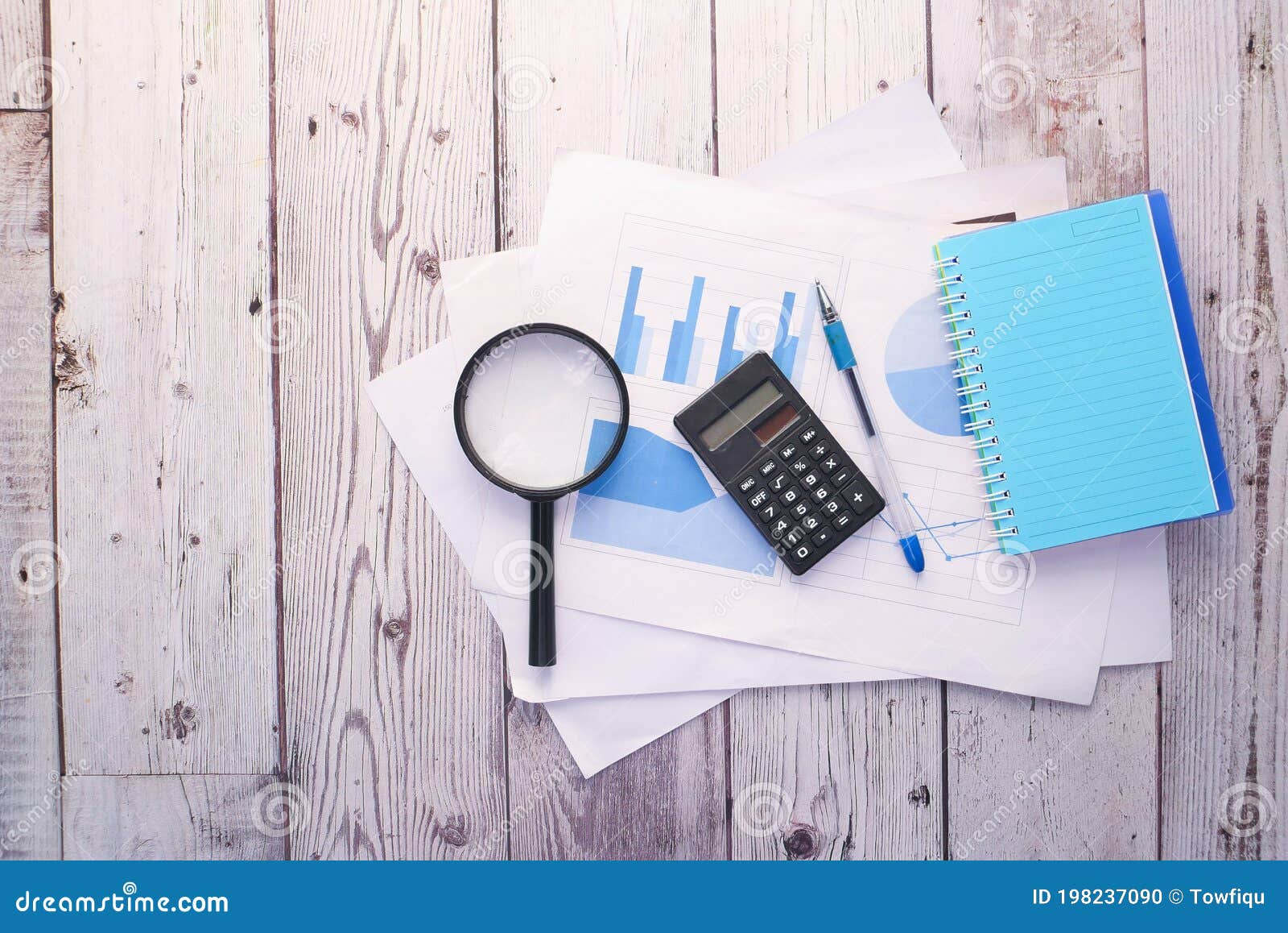 Financial Graph, Calculator and Notepad on Table Stock Photo - Image of ...