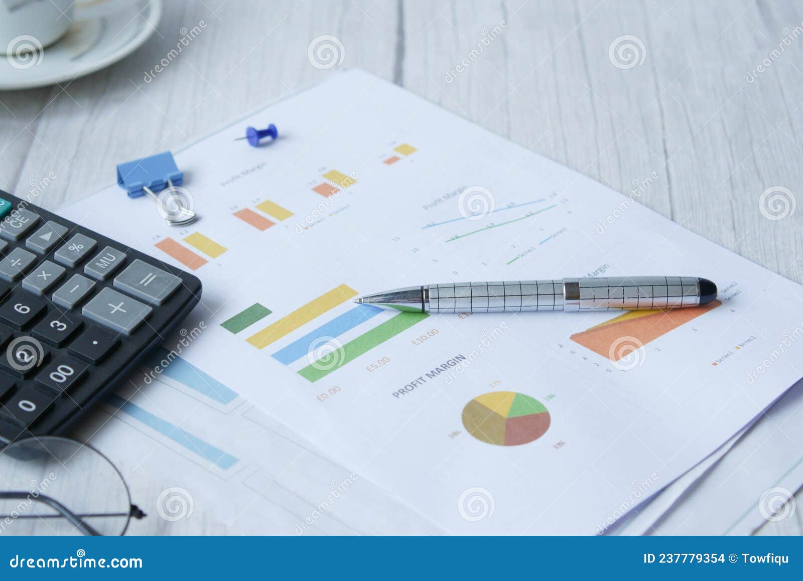 Financial Graph, Calculator and Notepad on Table Stock Photo - Image of ...