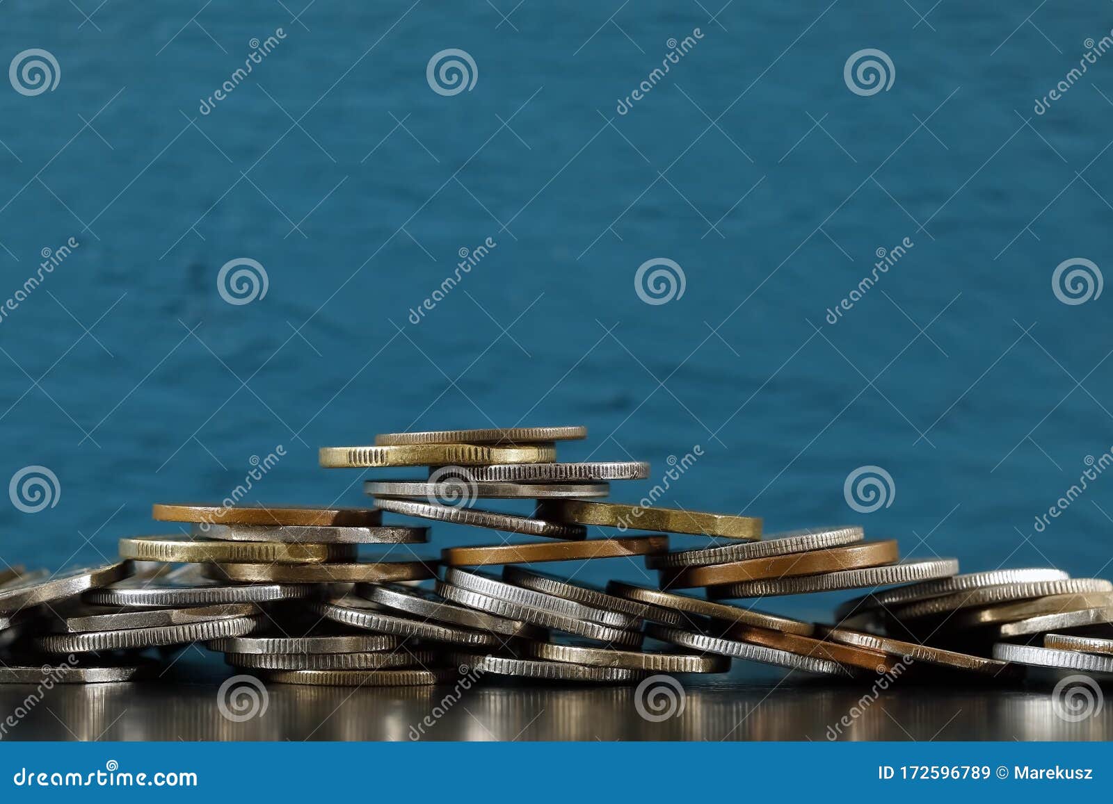 Financial Instability Expressed in Coins Stock Image - Image of finance ...