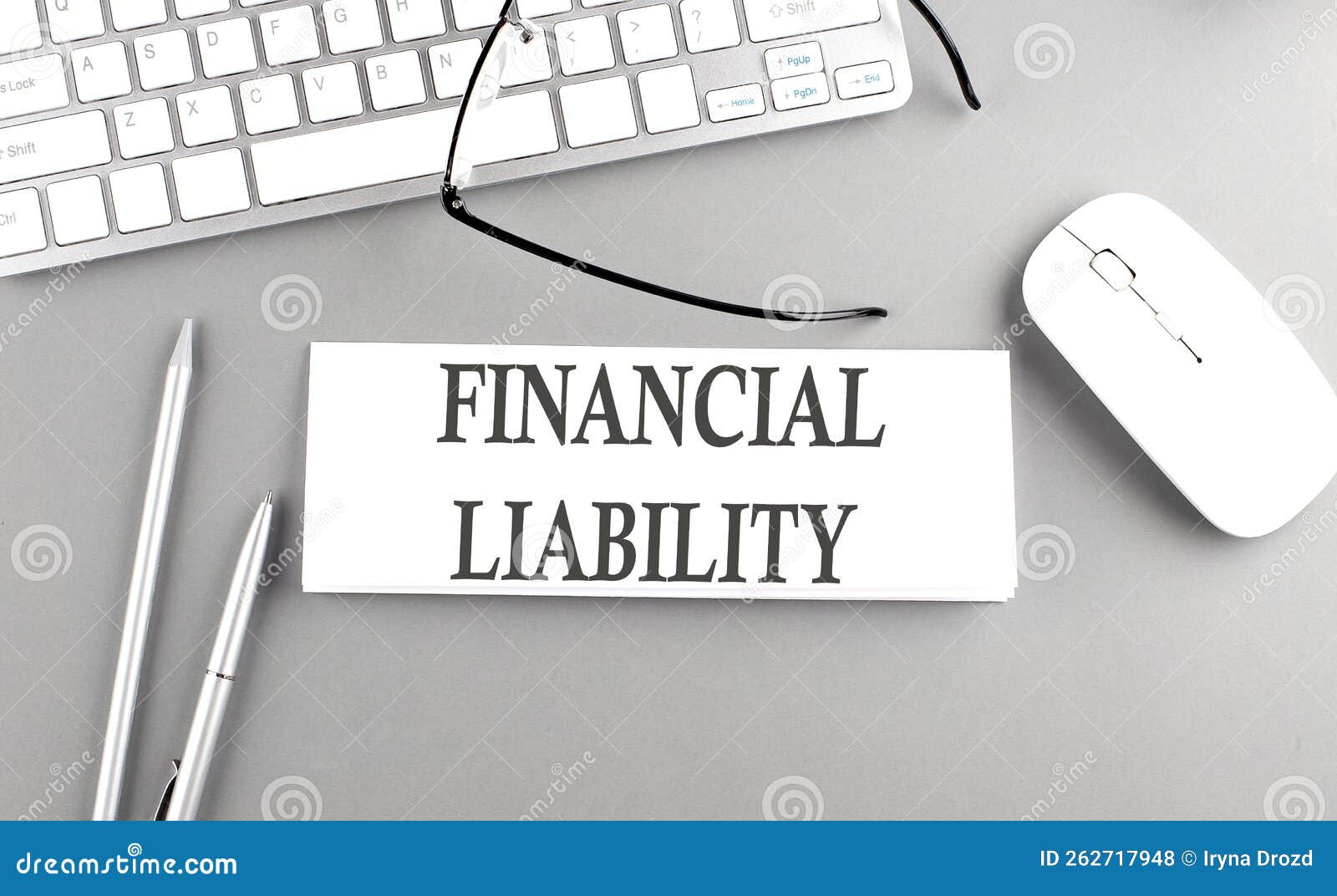 FINANCIAL LIABILITY Text on Paper with Keyboard on Grey Background ...