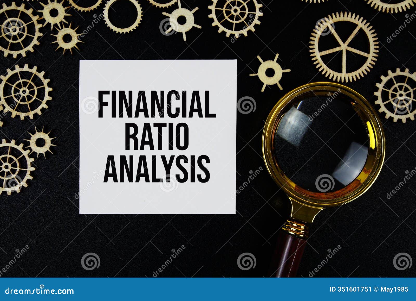 Financial Ratio Analysis Text with Magnifying Glass on Black Background ...