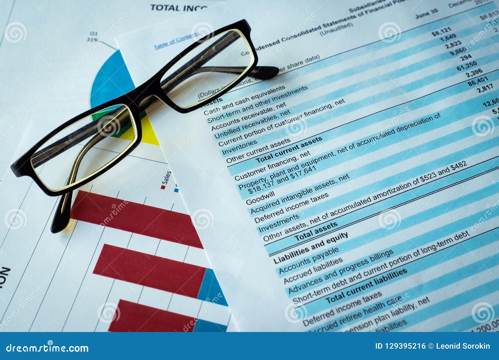 Financial Statement on Brown Envelope and Eyeglass, Business Concept ...