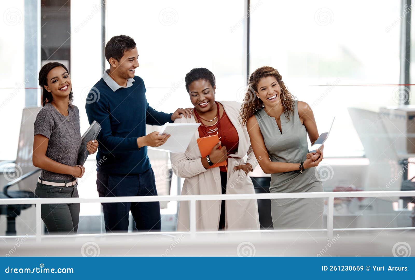 Finding the Funny Side of Things. a Happy Young Group of Colleagues ...