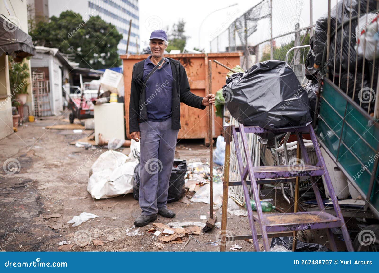 Finding Gems in the Dirt. a Man Sorting through Garbage at a Dumping ...
