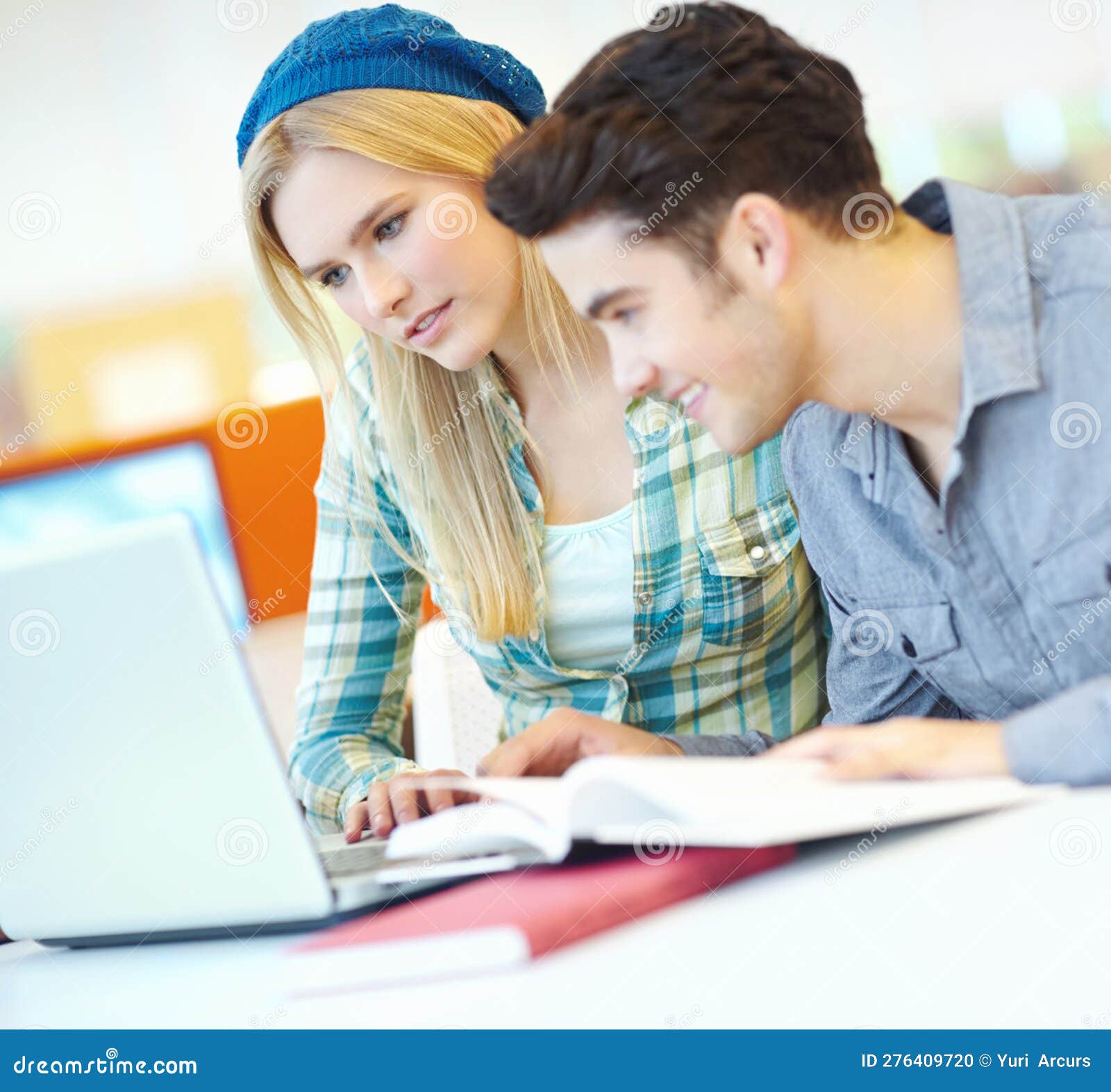 Finding Help on the Internet. Two Smiling Students Helping Each Other ...