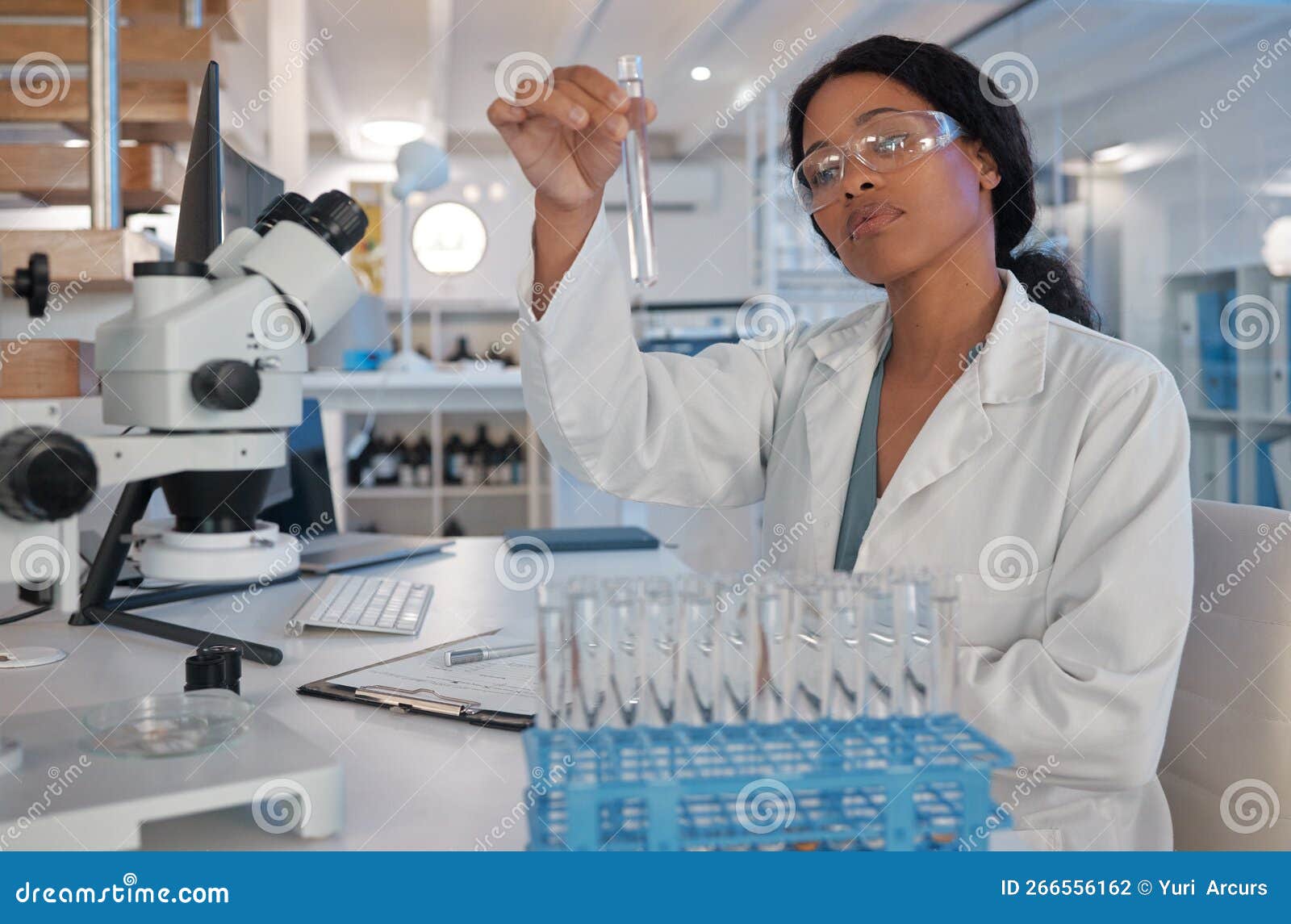 Finding that Perfect Spot. a Young Female Lab Tech Analysing a Sample ...