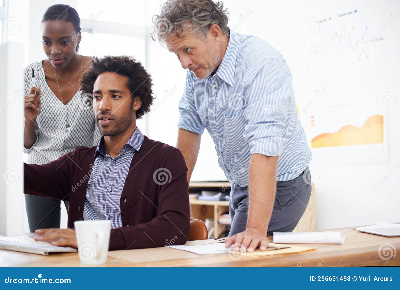 Finding Solutions Together. a Designer Showing His Latest Work To Two ...