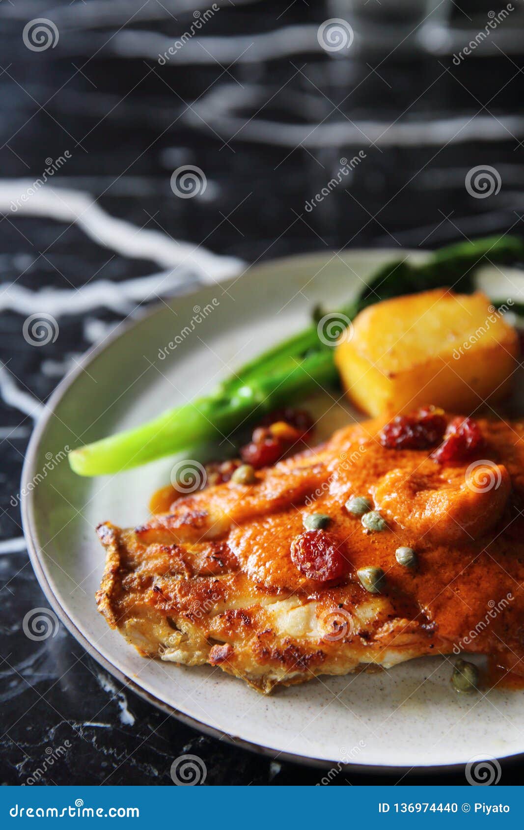 Fine Dining Seabass Fillets with Tomato and Spices Sauce Stock Photo ...
