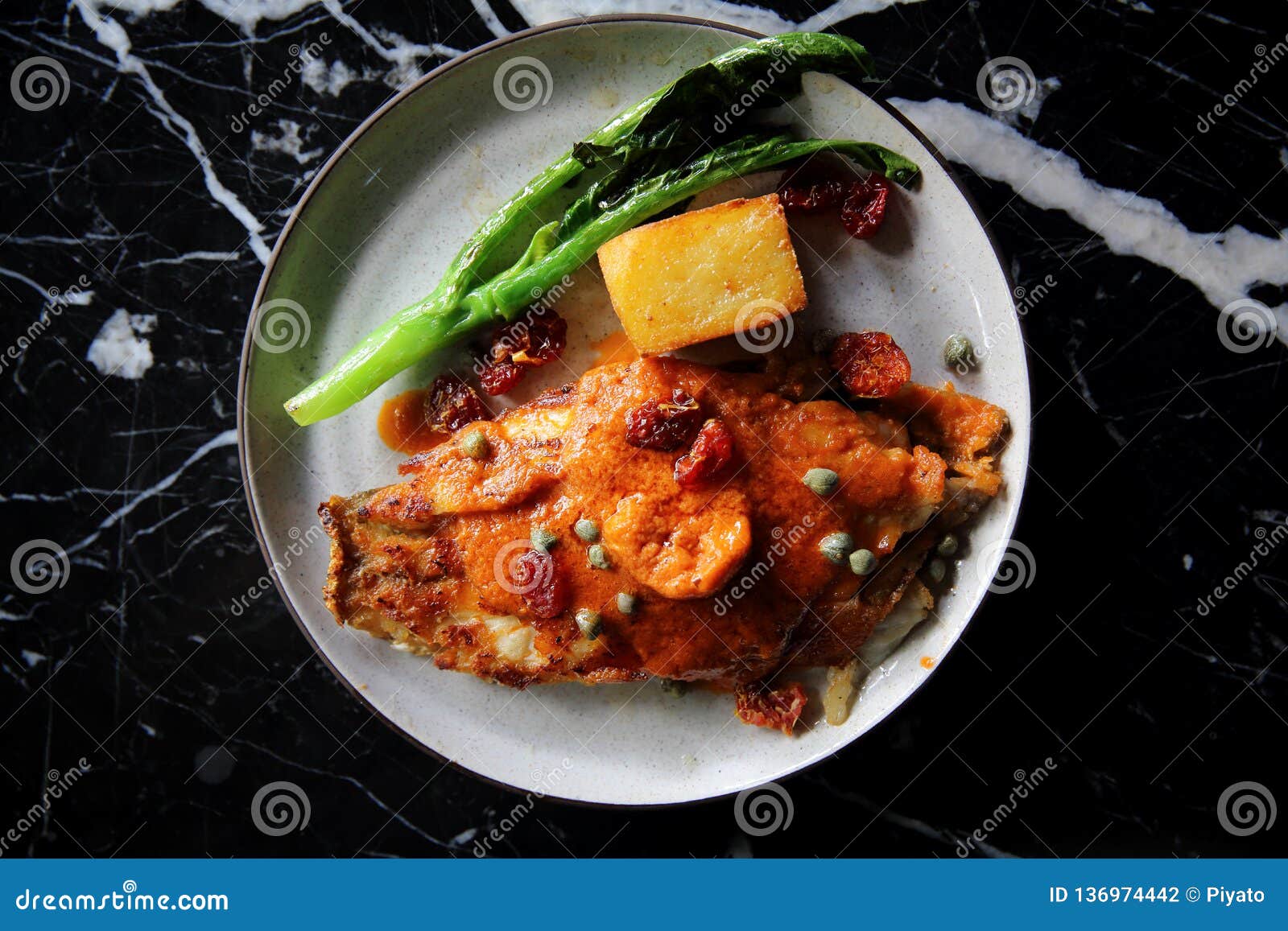 Fine Dining Seabass Fillets with Tomato and Spices Sauce Stock Photo ...